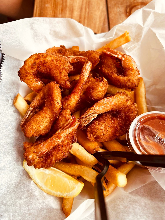 These fried shrimp aren't just golden brown—they're wearing crispy jackets that crunch like autumn leaves, revealing sweet ocean treasures inside.