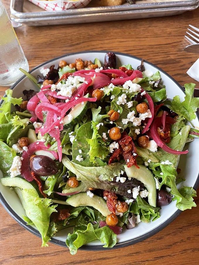 A salad that actually excites—crisp greens, pickled onions, and roasted chickpeas creating a symphony that makes virtuous eating feel indulgent.
