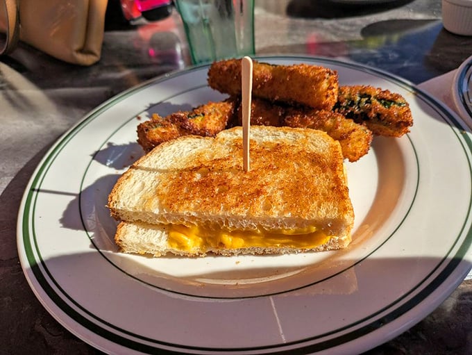 Grilled cheese and zucchini sticks—proof that comfort food doesn't need to grow up. That golden-brown exterior hides a molten cheese center that's worth every napkin you'll need.