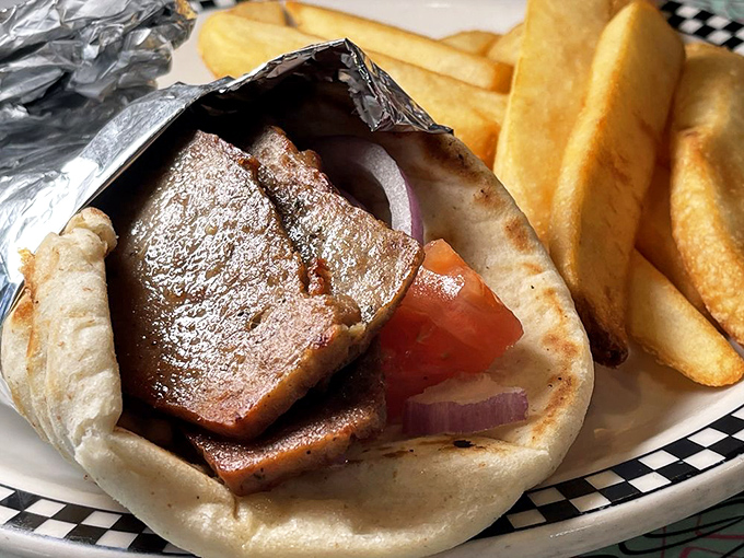 A proper gyro wrapped in foil—the lunch equivalent of opening a present. Mediterranean flavors with distinctly American portions.