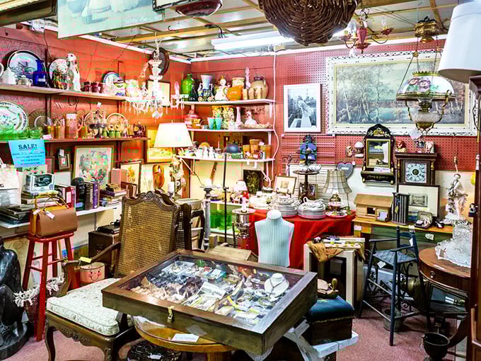 This vendor booth isn't cluttered—it's curated chaos where every lamp, frame, and knickknack tells a story waiting for a new listener.