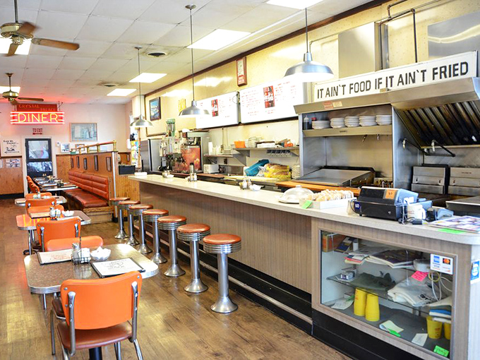 That neon "DINER" sign isn't just illuminating the room—it's lighting up a tradition of hospitality that defines small-town Indiana.