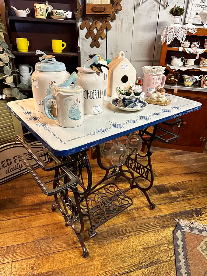 A sewing machine table reborn as the perfect showcase for Cinderella-themed ceramics—Disney meets domestic history in perfect harmony.