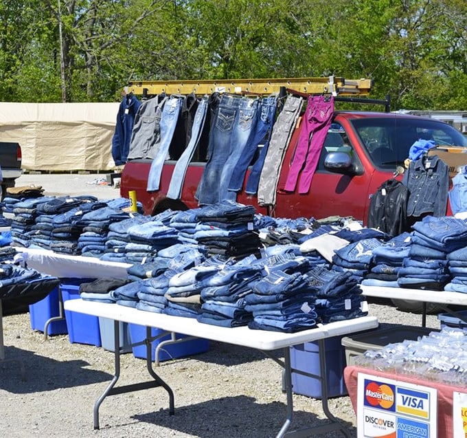 Denim heaven stretches across tables and hangs from improvised racks – a blue jean buffet where finding your perfect fit feels like winning the lottery.