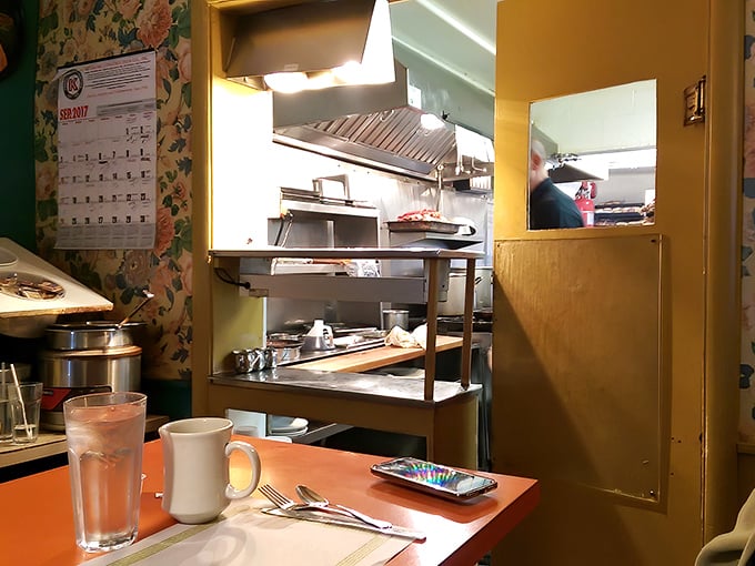 A glimpse into the kitchen battlefield where breakfast dreams are forged—no fancy equipment, just skill and a well-seasoned flat-top.