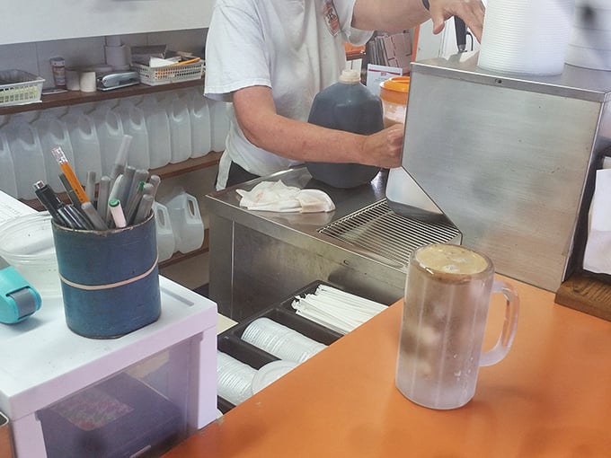 Behind the counter, the kitchen reveals the beautiful simplicity of American drive-in cuisine—no molecular gastronomy, just honest food prepared with decades of know-how.