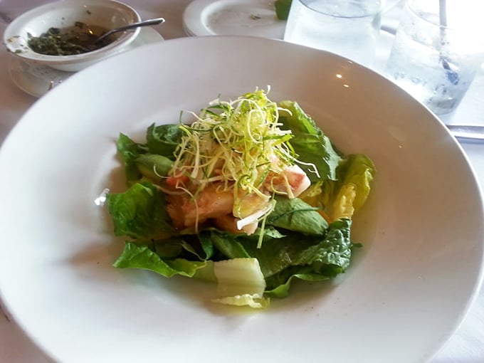 Even salads get the star treatment here – this delicate arrangement proves green doesn't mean boring when topped with perfectly cooked seafood.