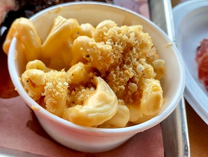 Mac and cheese with a golden crown of crispy breadcrumbs – comfort food wearing its Sunday best while still keeping things real.