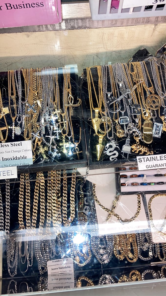Gleaming chains and pendants catch the light like fishing lures for humans. Stainless steel promises and symbols for every belief system.