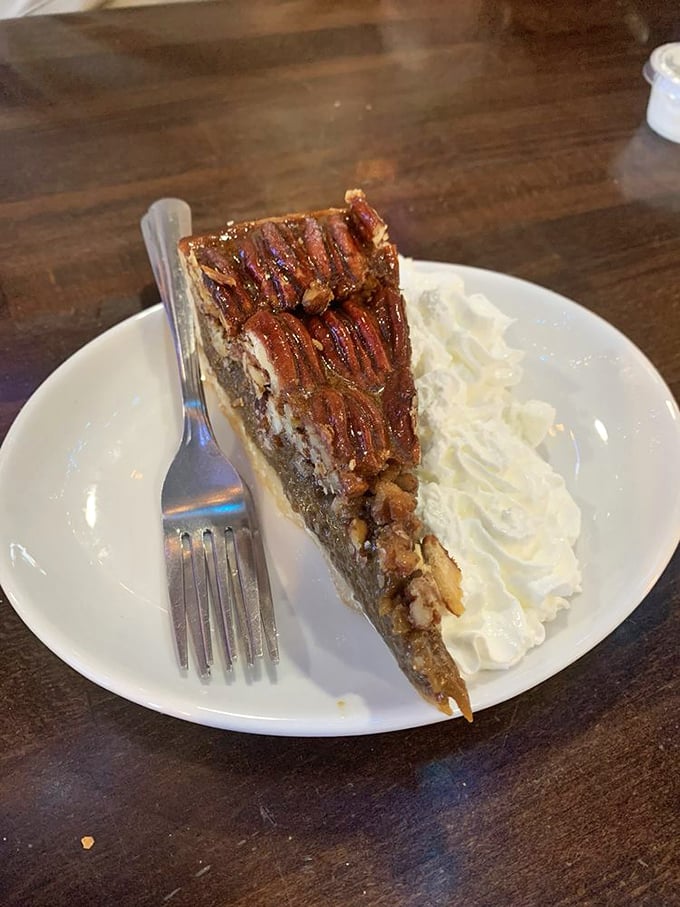 Pecan pie with enough whipped cream to ski down, sweet revenge for all that healthy seafood.