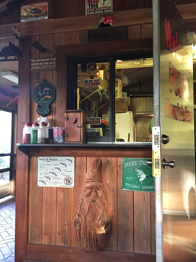 Behind this window, barbecue magic happens. Note the wood carving—even the decor has embraced the smokehouse aesthetic.