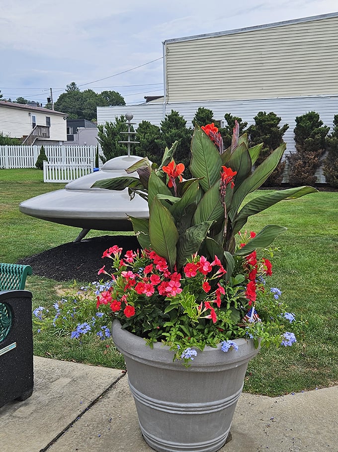 Earthly flowers provide a colorful contrast to the silver spacecraft, proving that Mars can indeed support beautiful life forms.