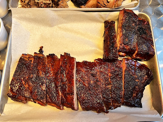 Ribs and brisket sharing a tray like old friends catching up. That bark is the result of time, patience, and smoke—three ingredients you can't rush.