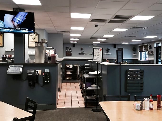 Where breakfast magic happens – the pass-through window offering glimpses into the choreographed chaos that somehow results in perfect eggs every time.
