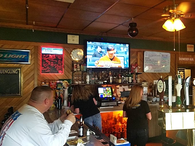 The bar area—where stories are shared, games are watched, and friendships are forged over perfectly poured pints.