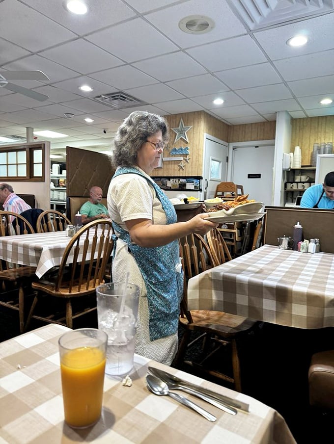 Servers moving with the precision of dancers and the memory of elephants. The aprons aren't uniforms—they're badges of honor.