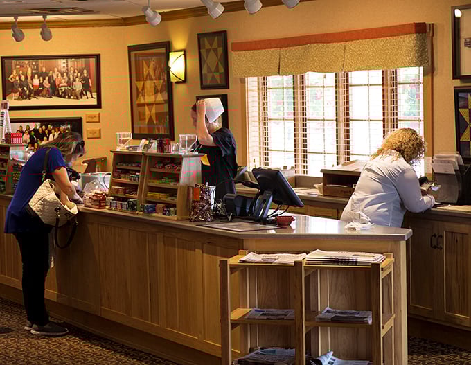The front counter staff—the gatekeepers to comfort food paradise—efficiently managing the flow of hungry pilgrims seeking culinary salvation.