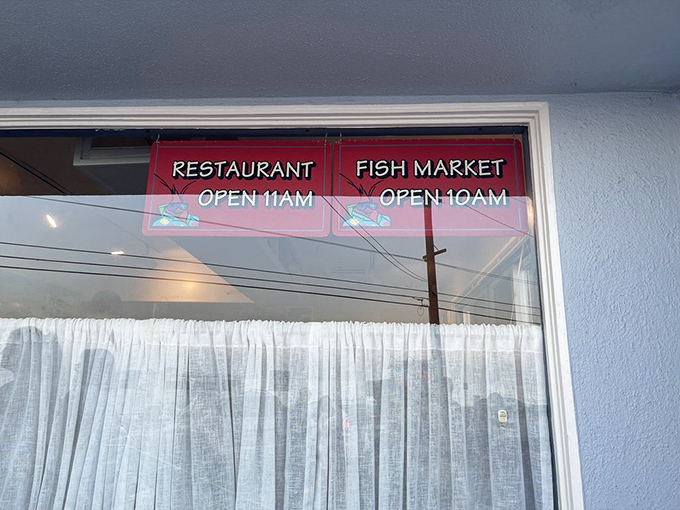 The restaurant's hours displayed with seafood icons – a subtle reminder that good things come to those who arrive when they're open.