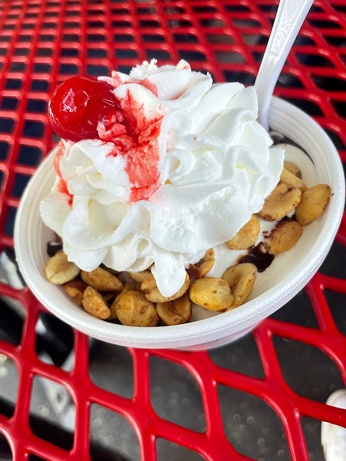 A sundae that speaks to your inner child—whipped cream mountain, cherry peak, and a foundation of peanuts that adds the perfect crunch.