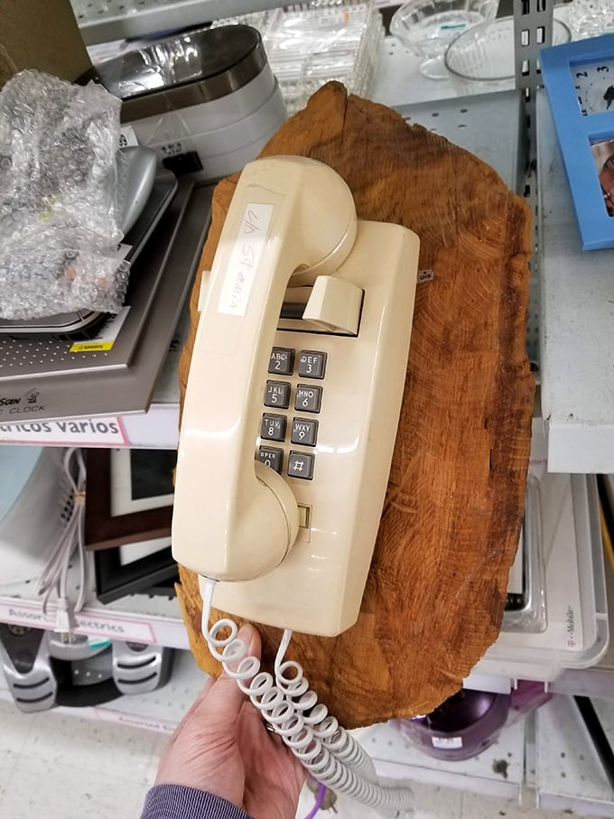 Remember wall phones? This cream-colored relic from the pre-smartphone era sits waiting for someone who appreciates retro communication style.
