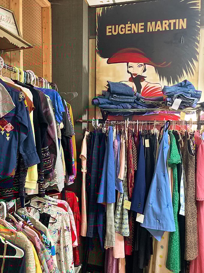 Vintage fashion awaits new adventures beneath a stylish poster. These clothes weren't just worn—they were lived in, danced in, and loved.