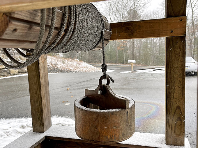 An old-fashioned well bucket hangs outside, a charming reminder that the best places always have one foot planted firmly in tradition.