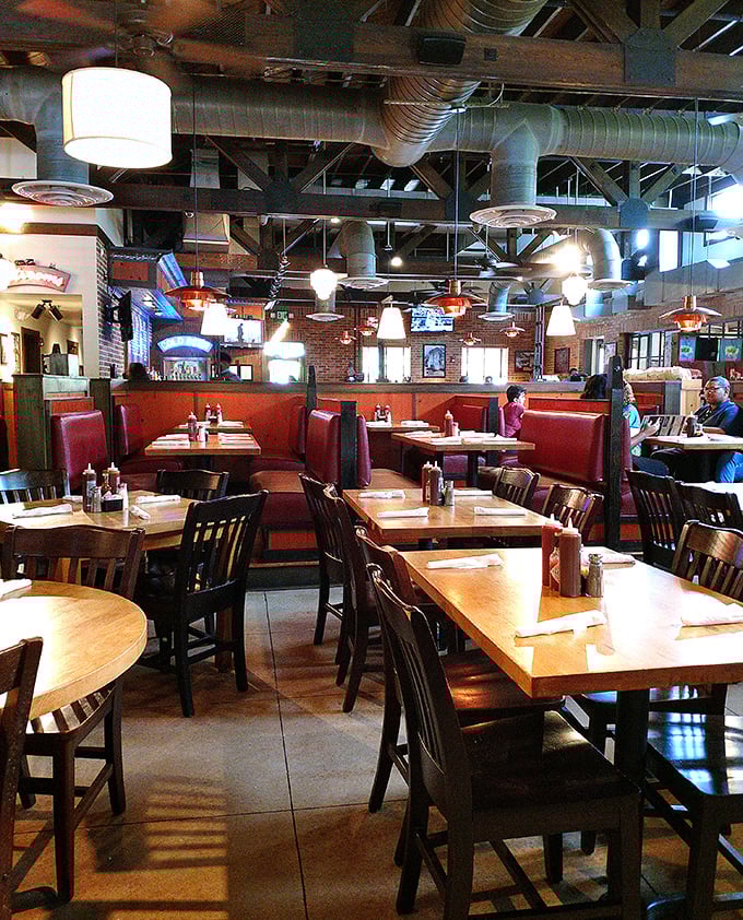 Red booths and wooden tables create the perfect stage for the main event—a barbecue performance that consistently earns standing ovations from sauce-stained napkins.