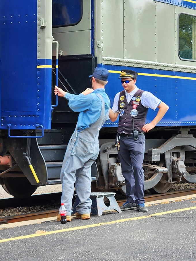 Railway operations require precision teamwork—these crew members coordinate with the easy confidence that comes from genuine passion for their craft.