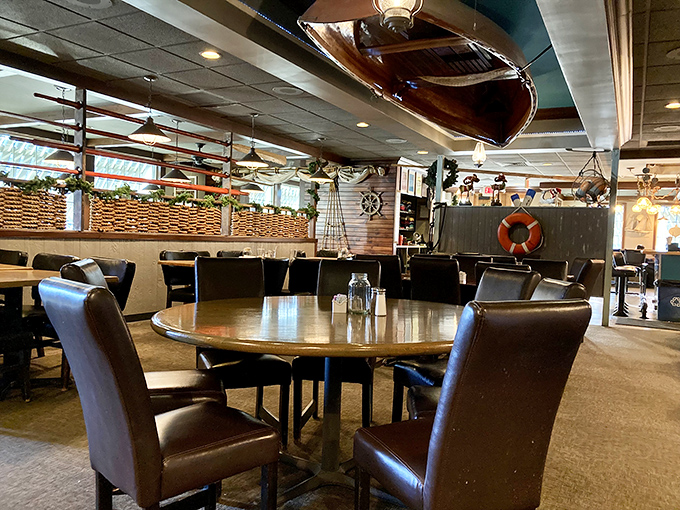 Wooden boats above, wooden tables below—dining under the watchful eye of maritime history. Atmosphere you can't manufacture.