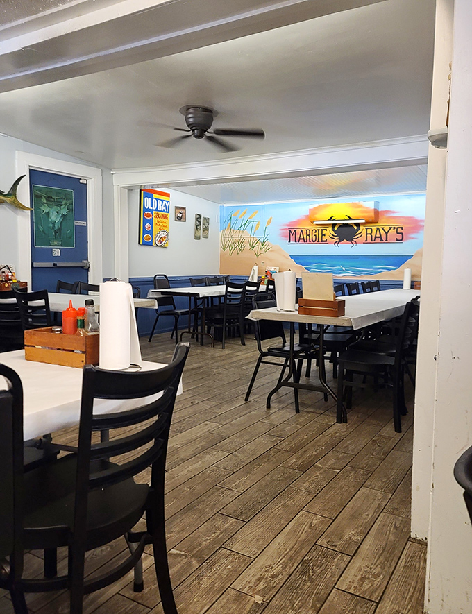 The beach-themed dining room doesn't just serve seafood – it transports you there. That mural isn't compensation for a view; it's a bonus.