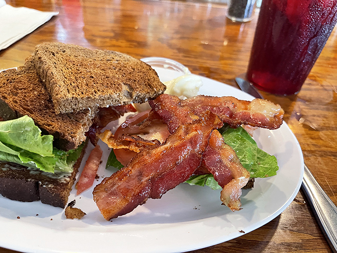 This BLT isn't messing around—bacon cooked to that perfect point between chewy and crisp, with lettuce and tomato playing necessary supporting roles.