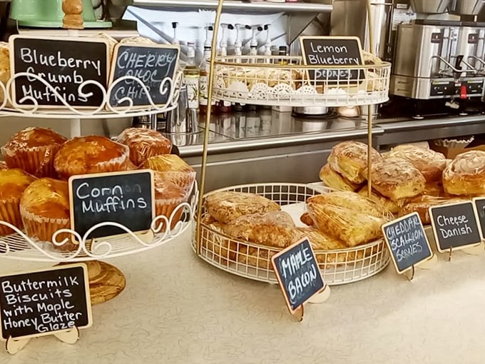 The pastry display—where good intentions about "just having coffee" go to die in the most delicious way possible.