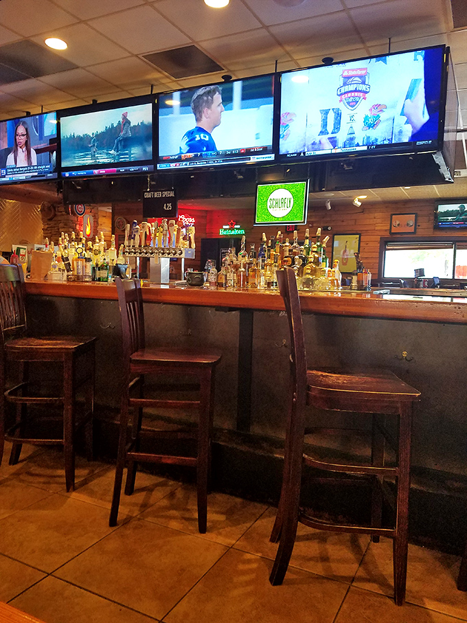 The bar area—where sports on screens and amber bottles create that perfect "third place" between work and home that every community needs.