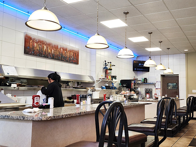 Where the magic happens – the counter seating offers a front-row view to the choreographed chaos of short-order cooking.