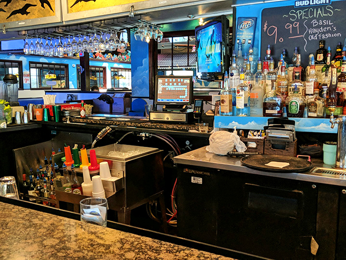 This isn't just a bar—it's command central where libations are crafted to complement the briny delights on your plate.