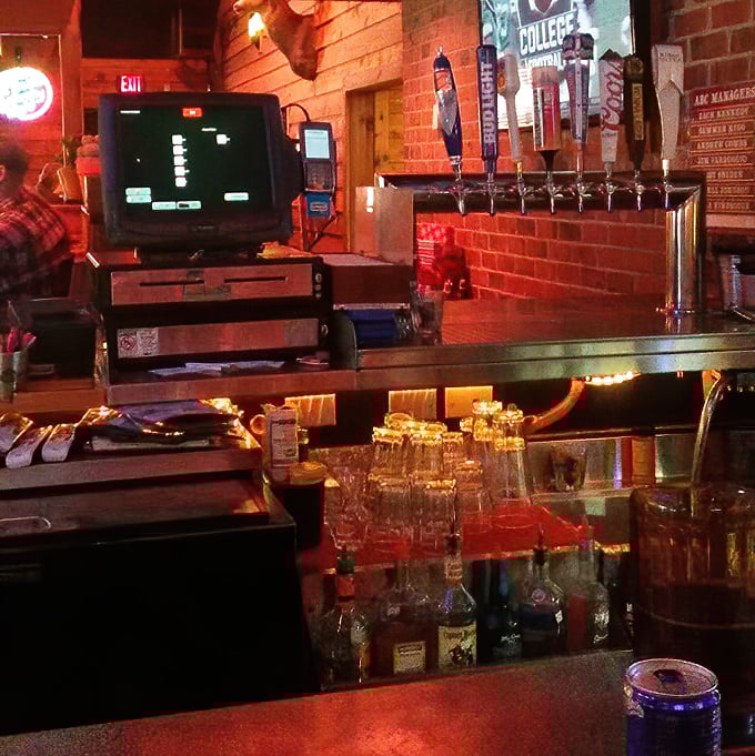 The bar glows with potential in that magical restaurant lighting that makes everyone look like they're having the best time ever.