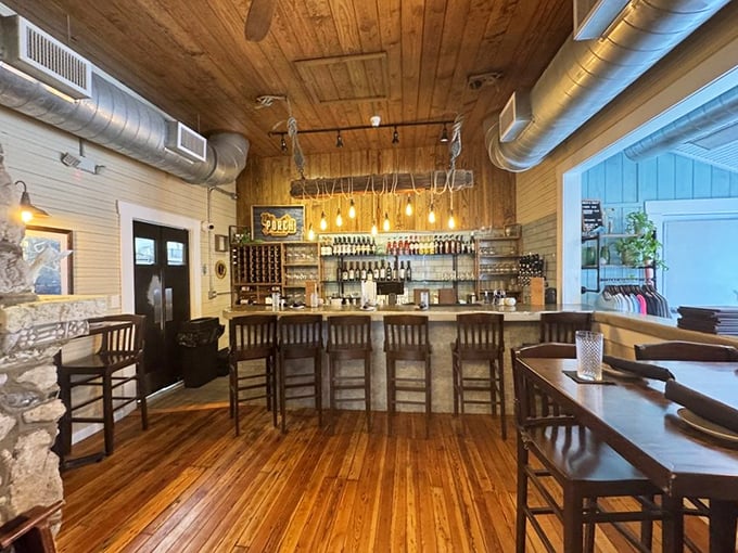 The bar area combines rustic charm with island casual—like if Hemingway designed a space for people who actually enjoy company.