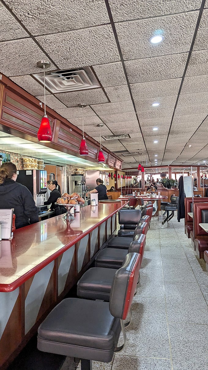 The counter seats: front-row tickets to the greatest show on earth—short-order cooks performing breakfast ballet.