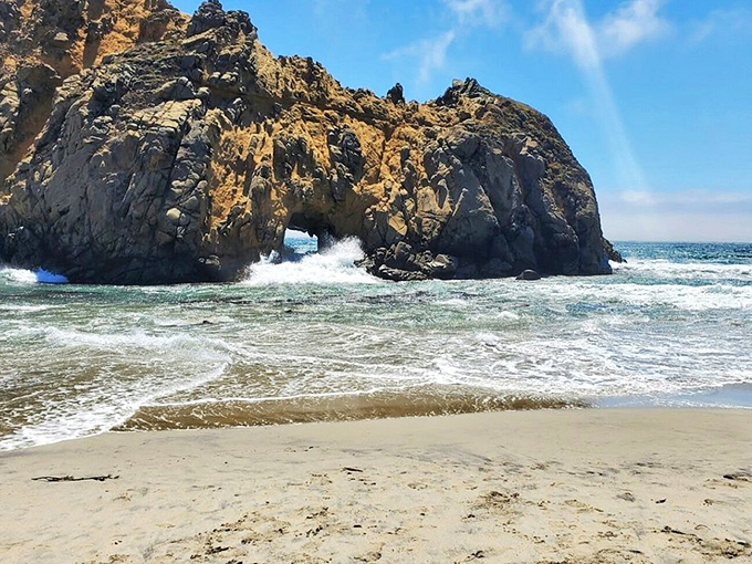 This hidden cove with its perfect arch seems almost too picturesque to be real—like nature showing off just because it can.