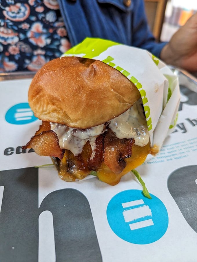 Behold the Big Iron Burger in all its glory—where melty cheese and bacon jam create the kind of messiness worth every napkin.