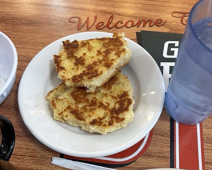 These aren't just griddled biscuits—they're golden discs of buttery perfection waiting to be the supporting actors in your breakfast drama.