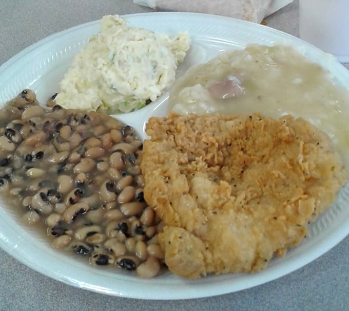 A holy trinity of Southern comfort: black-eyed peas, creamy potato salad, and chicken that's been introduced to hot oil with spectacular results.