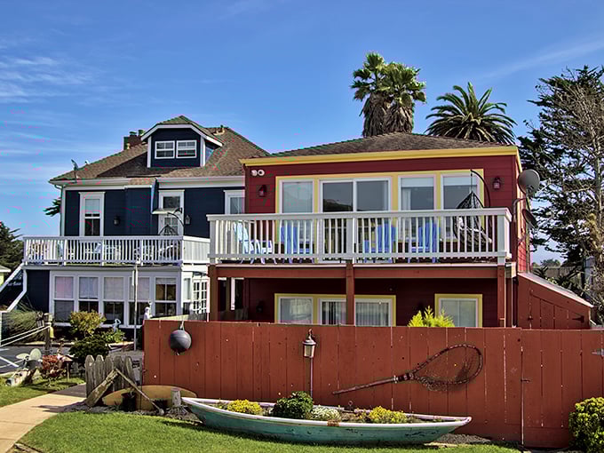 Coastal living in technicolor. These harborside homes blend nautical whimsy with practical charm—complete with the requisite fishing net fence decoration.