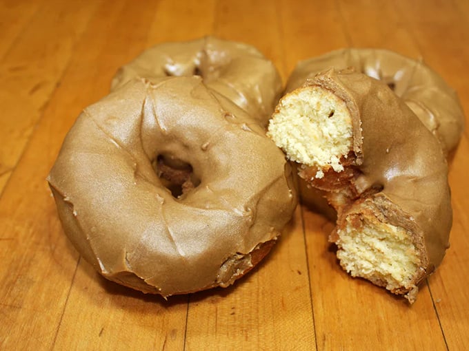The maple-glazed cake donut—dense, moist, and unapologetically indulgent. One bite and you'll understand why people line up before dawn.