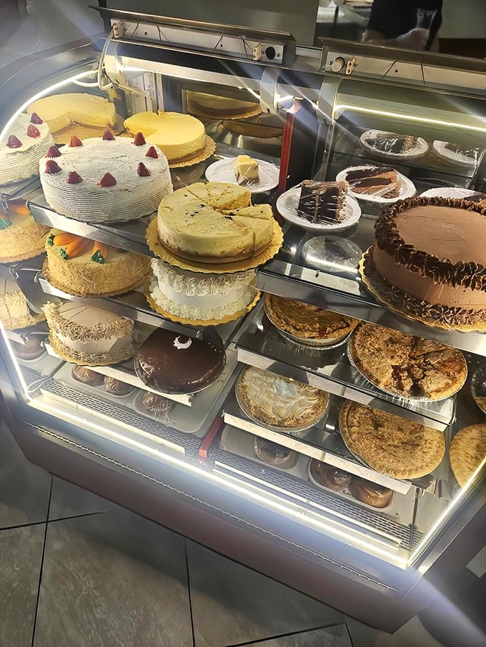 The display case showcases desserts that tempt even the most disciplined breakfast-only dining intentions.