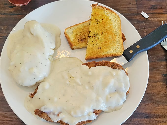 Country gravy isn't just a topping—it's a commitment, a lifestyle choice, and on this chicken fried steak, it's absolutely non-negotiable.