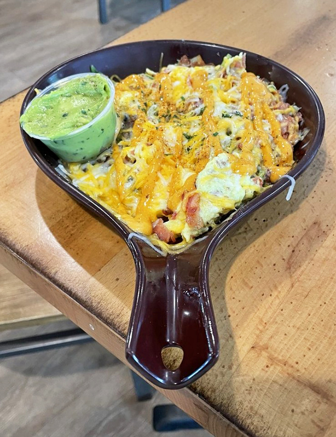 This skillet doesn't just contain breakfast—it tells a story of cheese, eggs, and savory ingredients having the world's most delicious reunion.