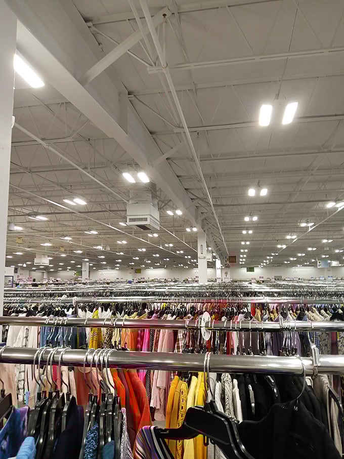 The clothing section stretches like a fabric ocean, with every color in the spectrum represented in this secondhand fashion paradise.