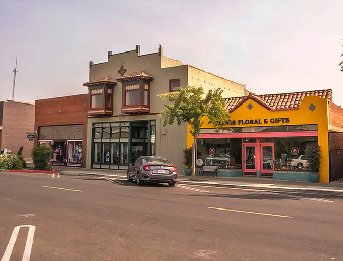 The cheerful yellow facade of Clovis Floral & Gifts brightens the streetscape, much like the town itself brightens the retirement prospects of newcomers.