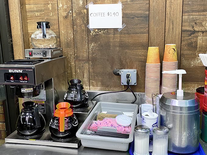 The coffee station: humble, utilitarian, and essential as sunrise. No barista theatrics here—just honest brew for honest people with donut dreams.